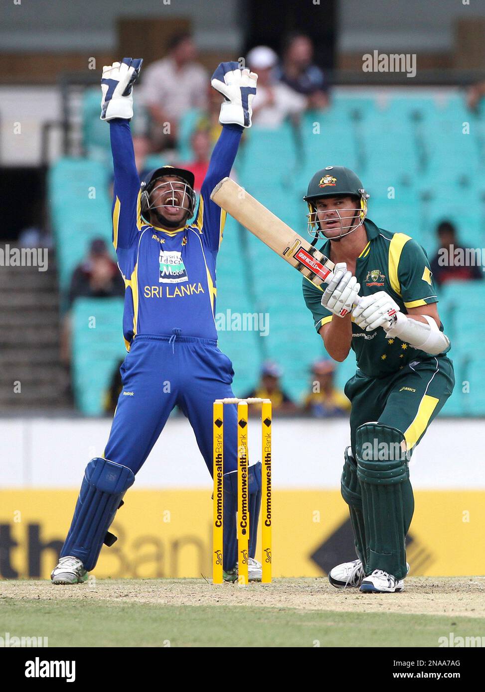 Sri Lanka's wicketkeeper Kumar Sangakkara, left, celebrates the wicket ...