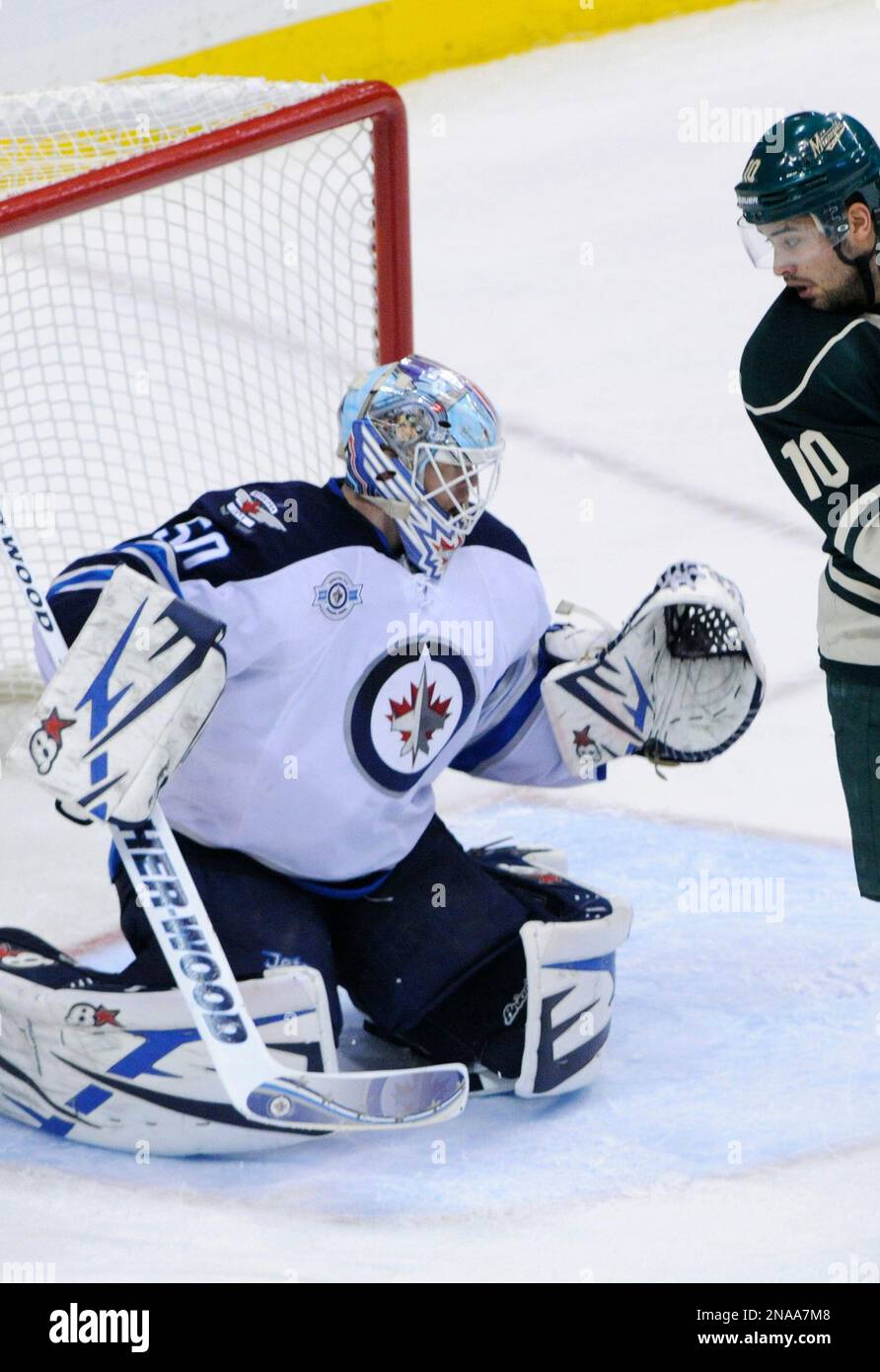 Winnipeg Jets goalie Chris Mason, left, and Minnesota Wild's Devin ...