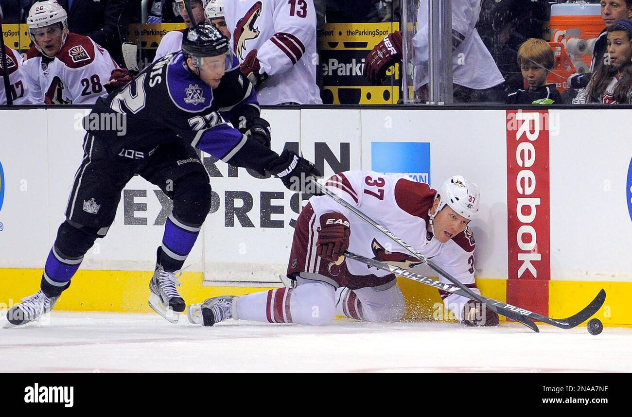 Los Angeles Kings center Trevor Lewis, left, and Phoenix Coyotes left ...