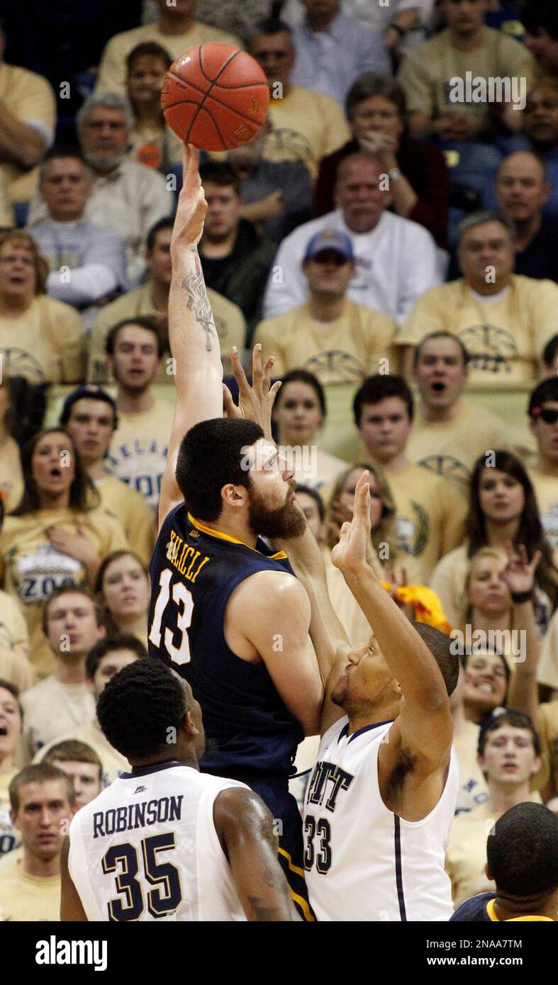 West Virginia's Deniz Kilicli (13) scores over Pittsburgh's Malcolm ...
