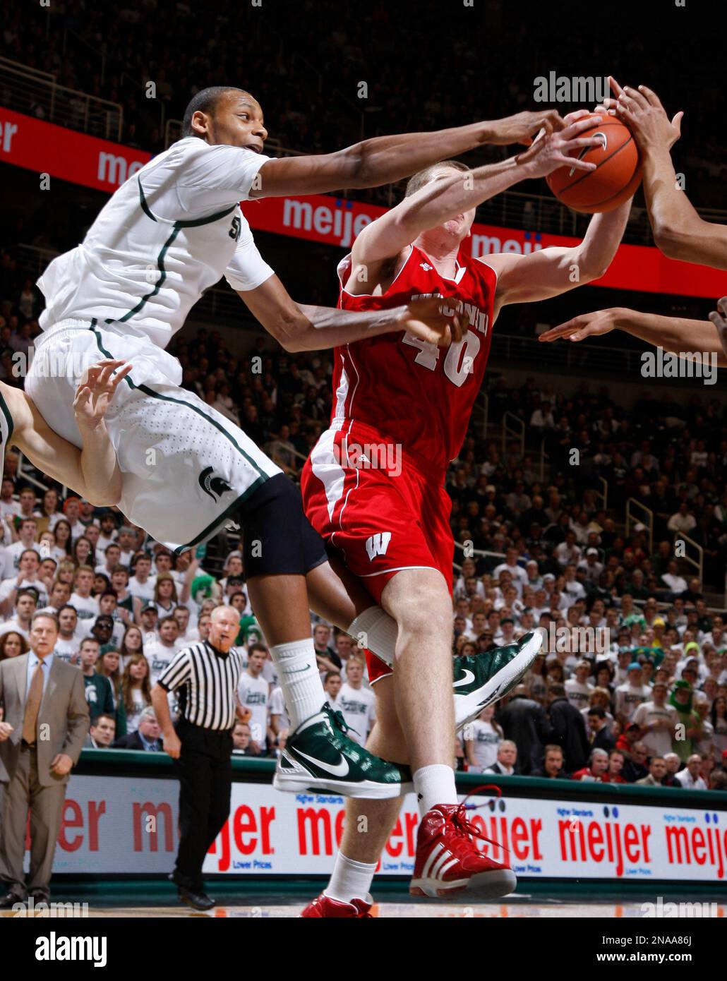 Michigan State's Adreian Payne, left, and Wisconsin's Jared Berggren ...