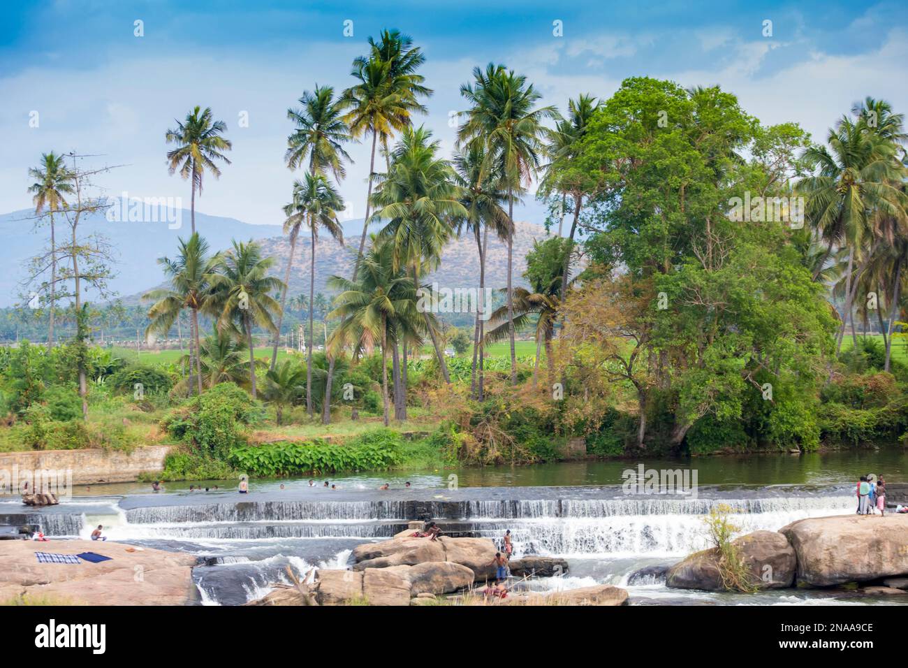 Villagers bathing in river in the countryside near Madurai; Madurai ...