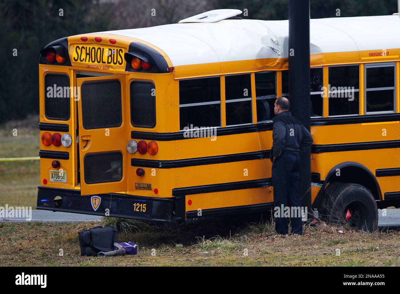 An Investigator views the scene of a school bus crash Thursday, Feb. 16 ...