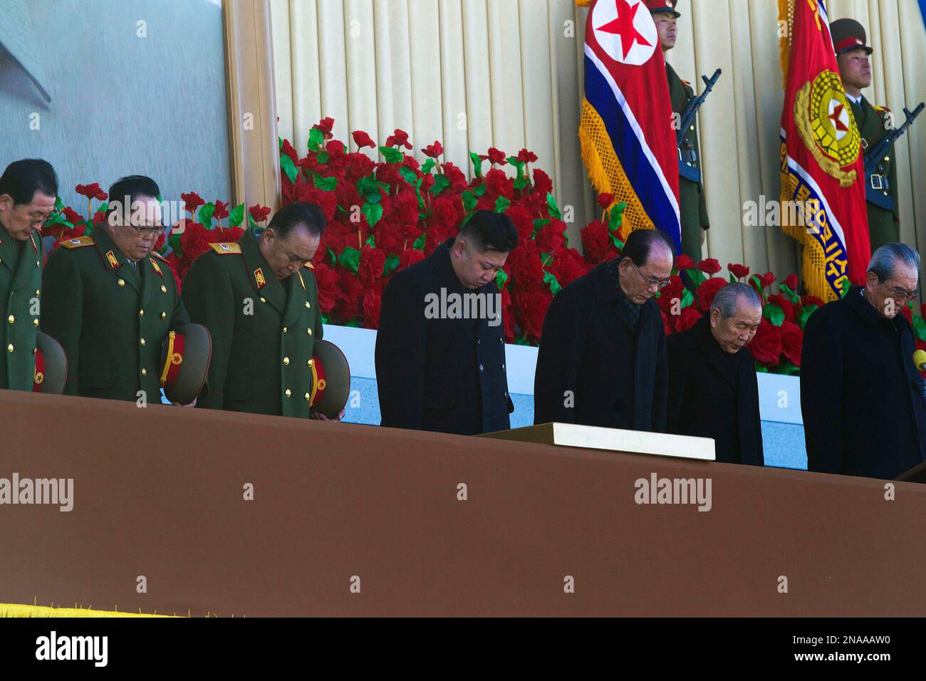 New North Korean leader Kim Jong Un, center, and senior political and ...