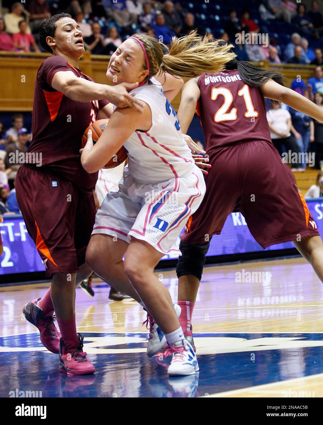 Duke's Tricia Liston drives between Virginia Tech's Monet Tellier, left ...