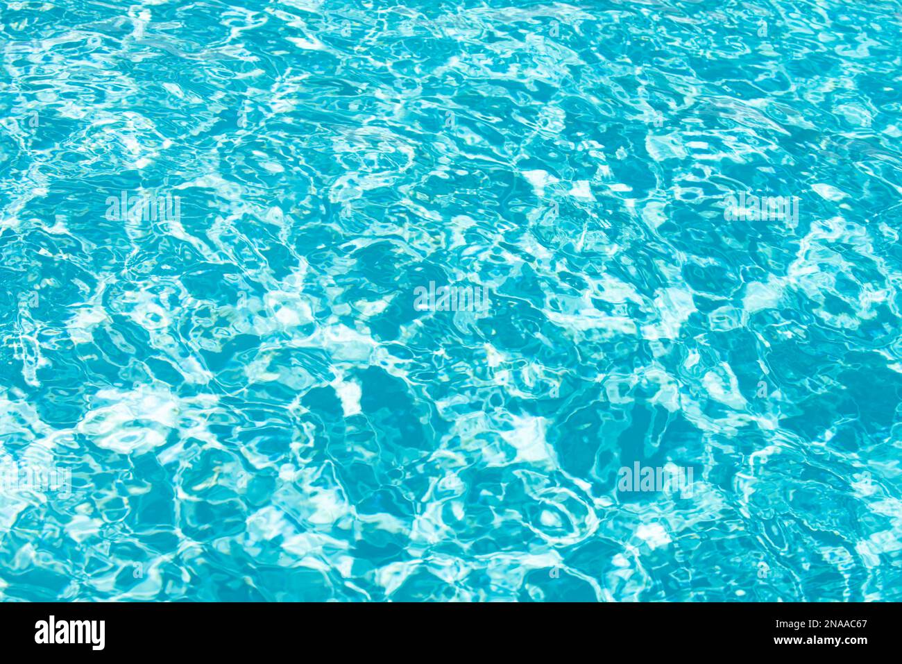 Water in swimming pool, background with high resolution. Wave abstract or rippled water texture ...