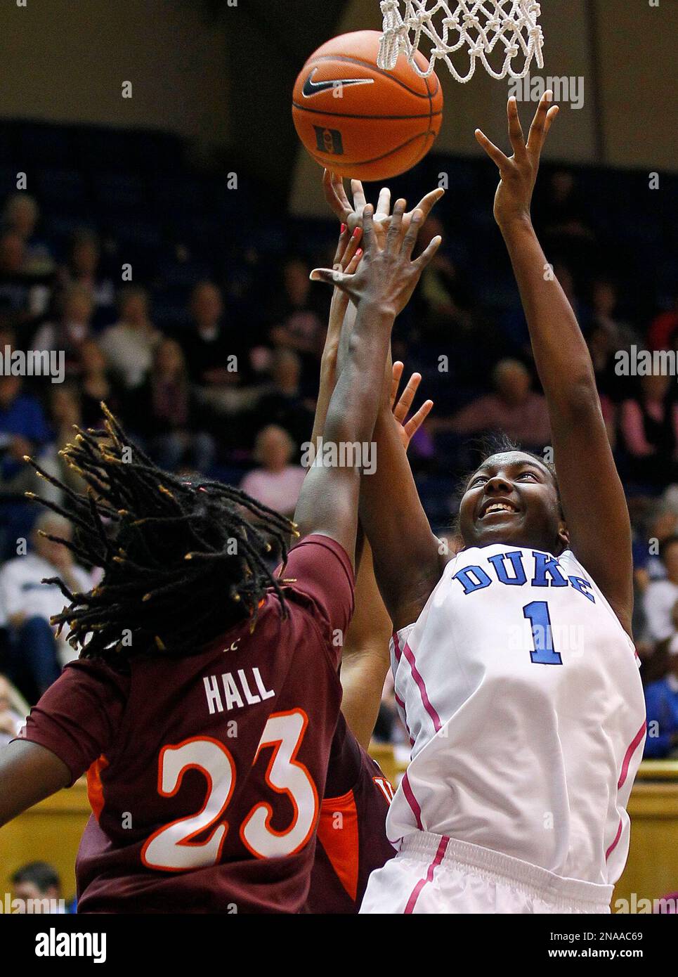 Duke's Elizabeth Williams (1) shoots as Virginia Tech's Larryqua Hall ...