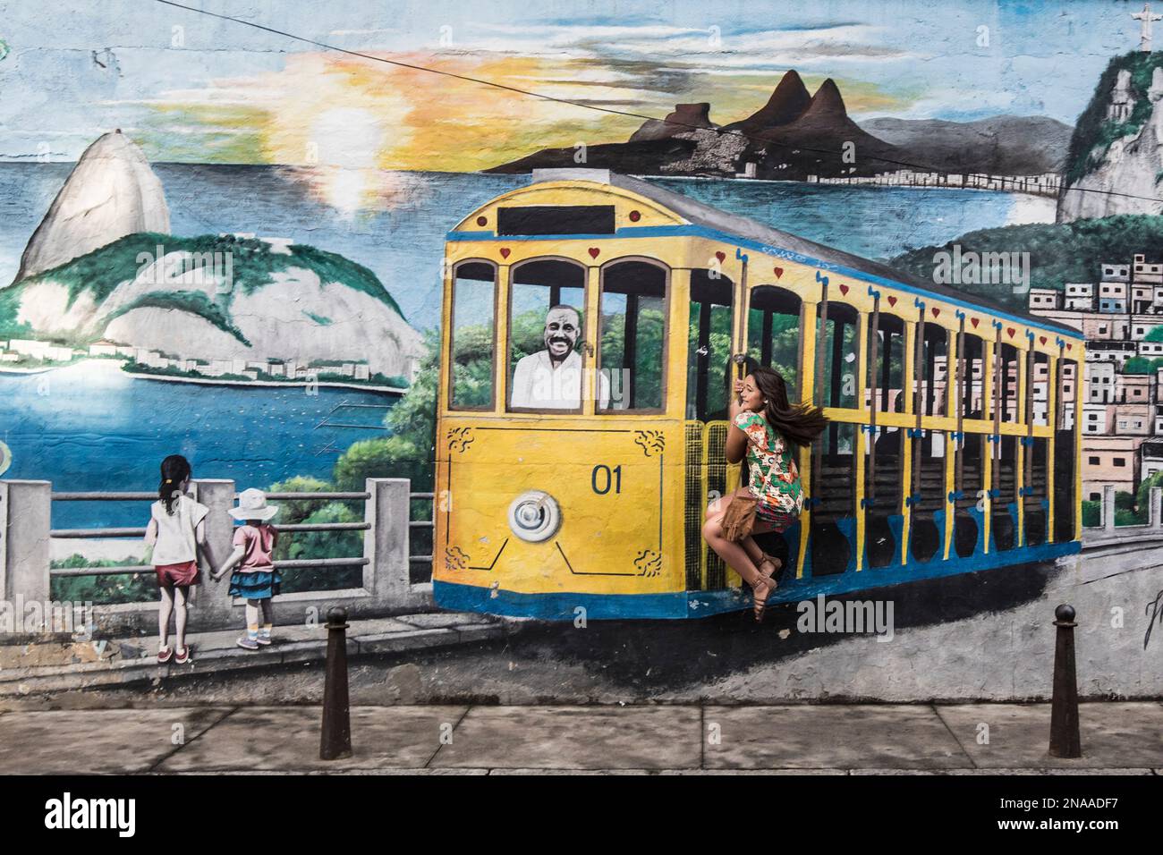 Mural of tram of Rio and Santa Teresa Tramway with girl jumping in ...