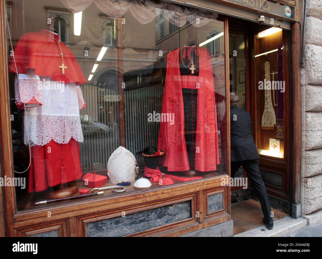 Cardinal robes are displayed in a shop window in Rome, Wednesday, Feb ...