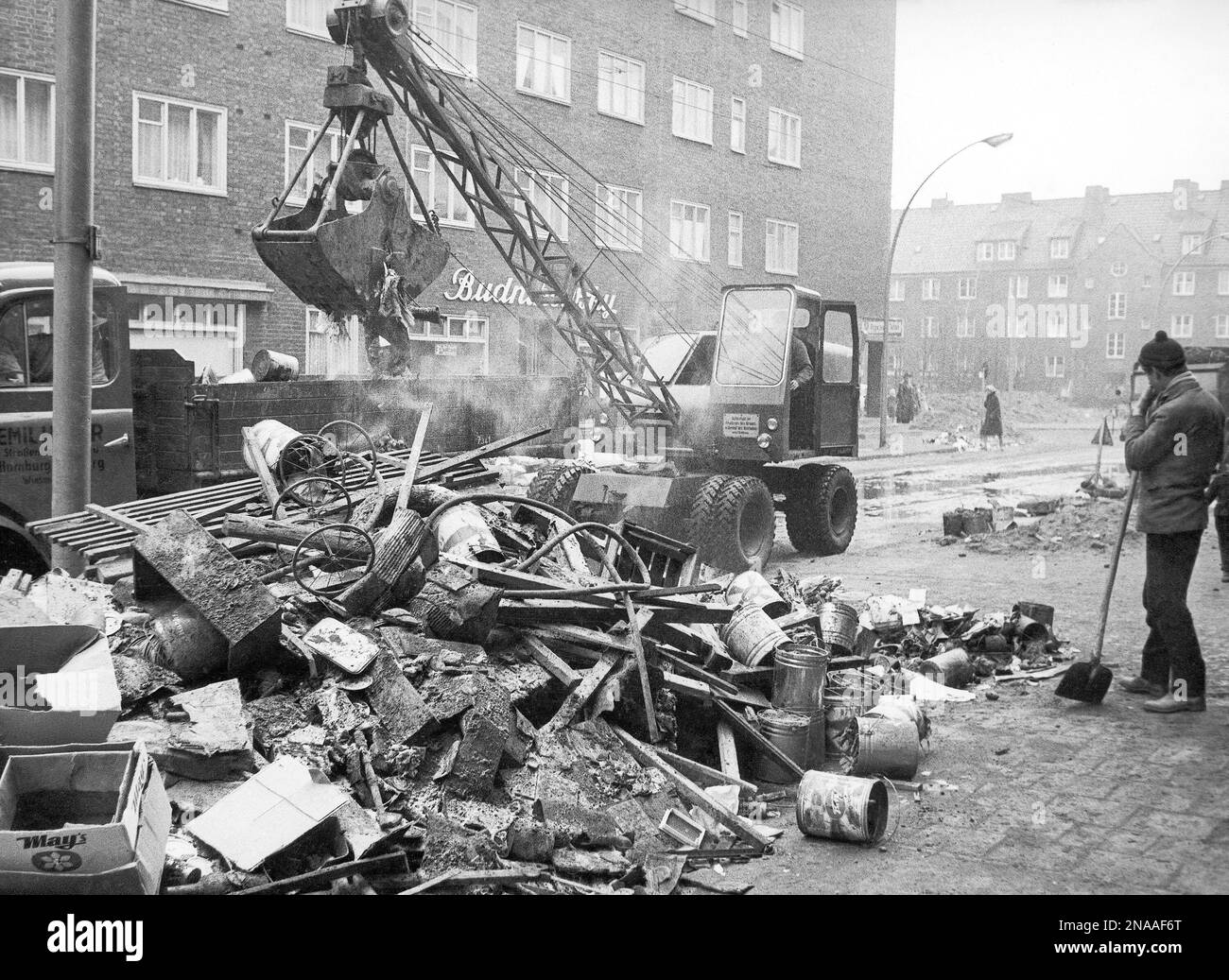 Debris in a downtown street is removed after floods in Hamburg, Germany ...