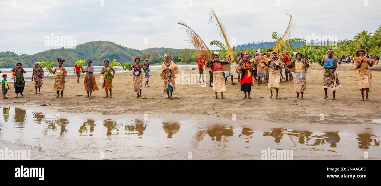 Village women in tapa bark cloth dresses preparing to perform ...