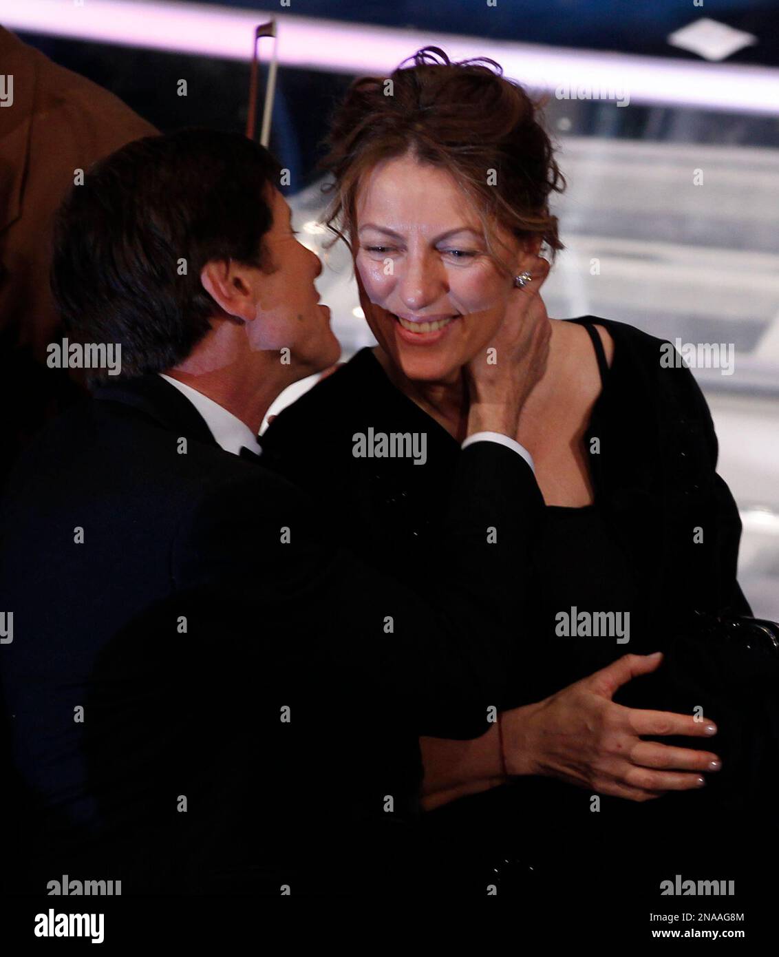 Italian show host Gianni Morandi kisses his wife Anna Dan during the ...