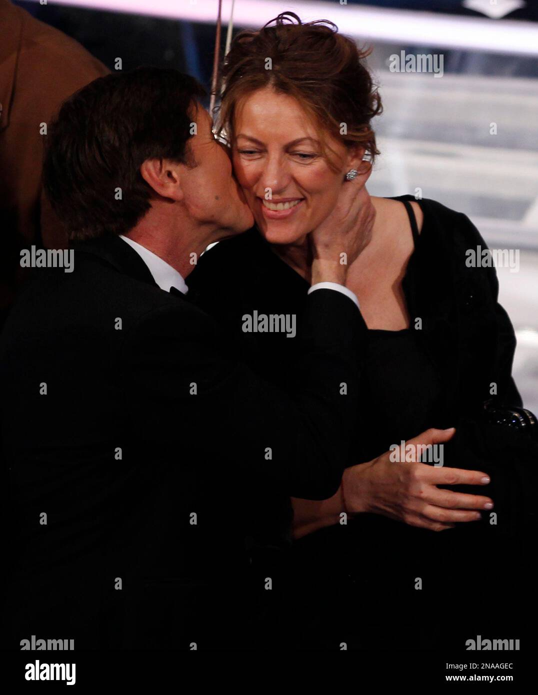 Italian show host Gianni Morandi kisses his wife Anna Dan during the ...