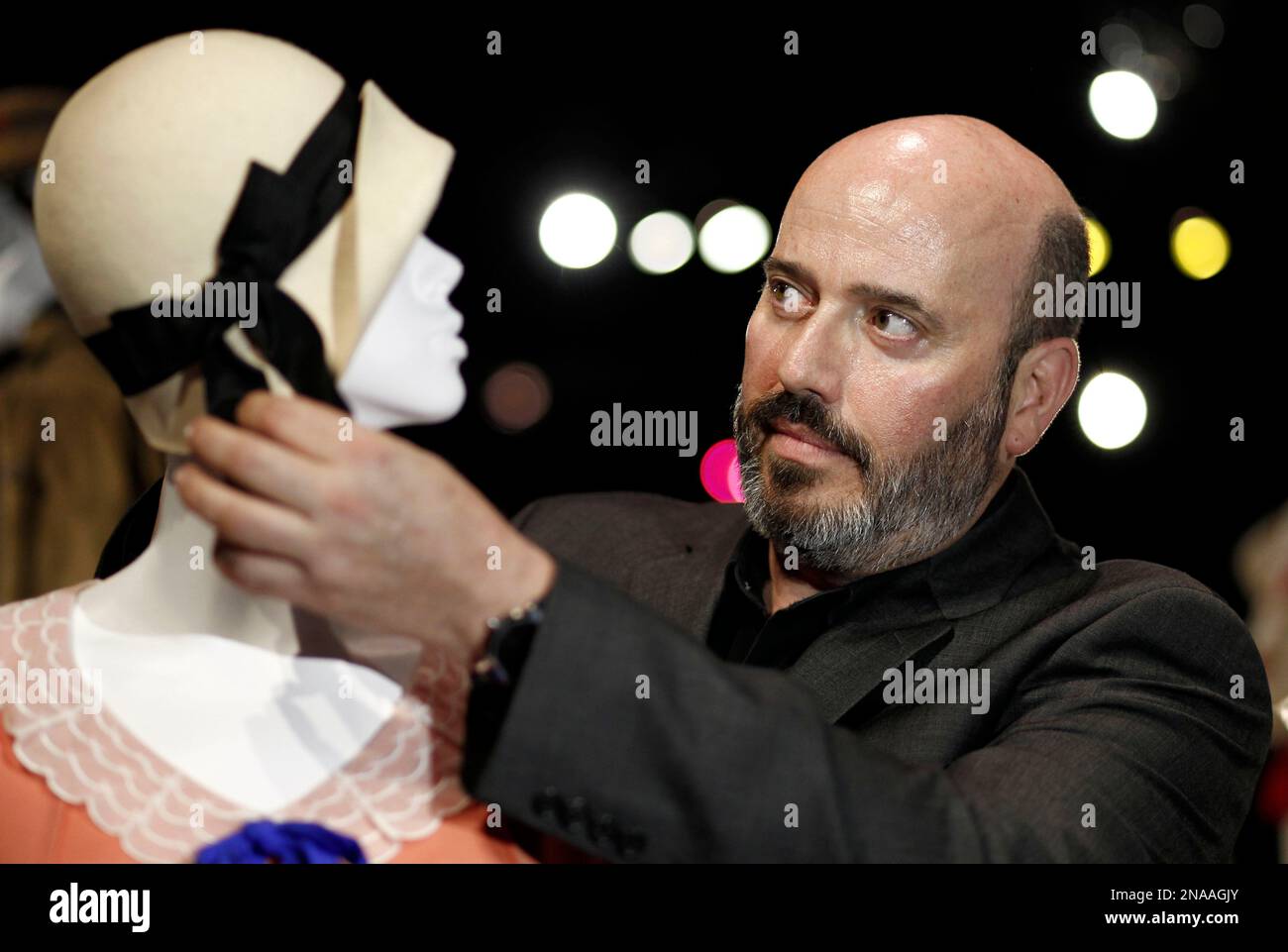 Costume designer Mark Bridges poses with his designs from the film "The ...