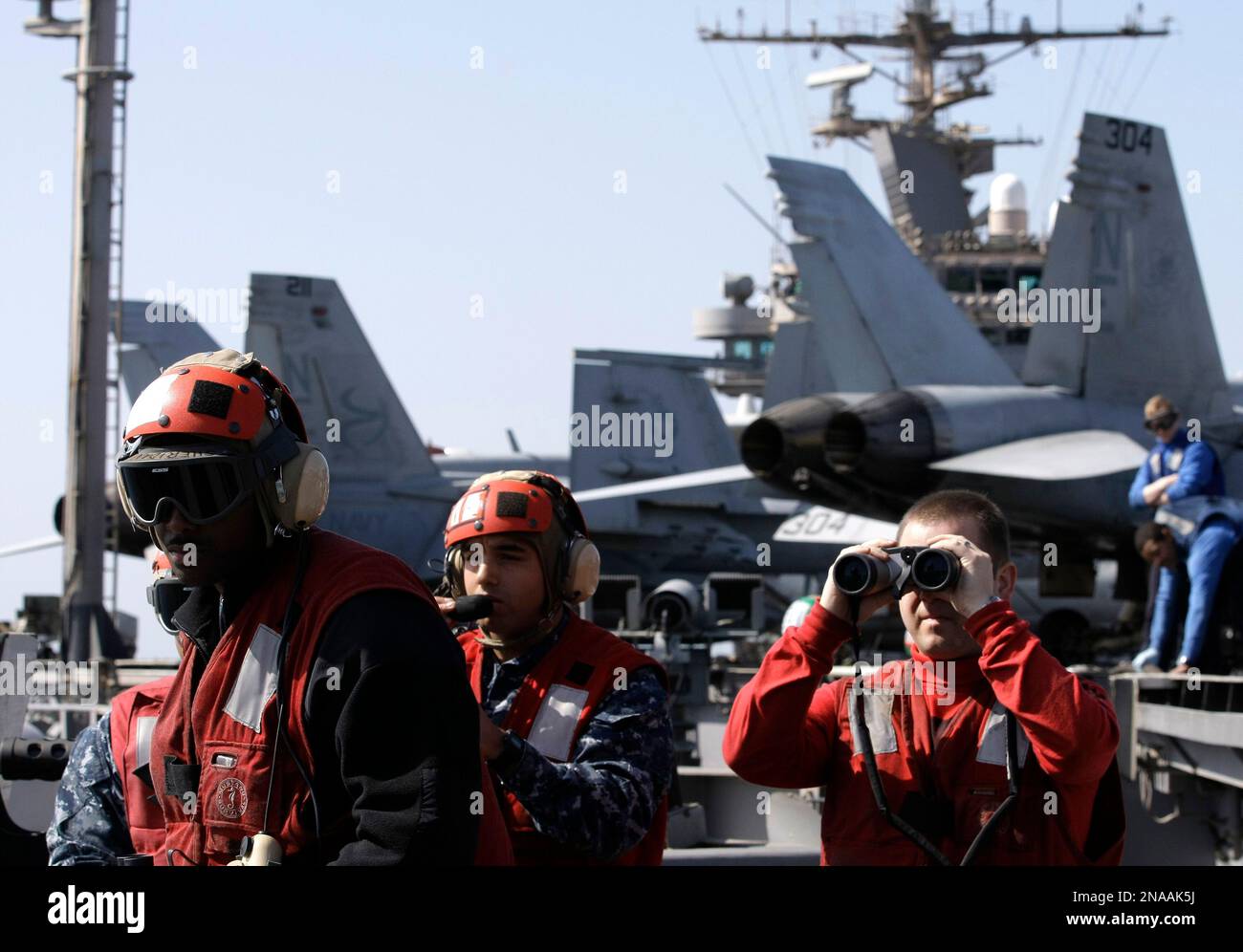 Crew Look Out Over The Arabian Sea From The Flight Deck Of The Nimitz