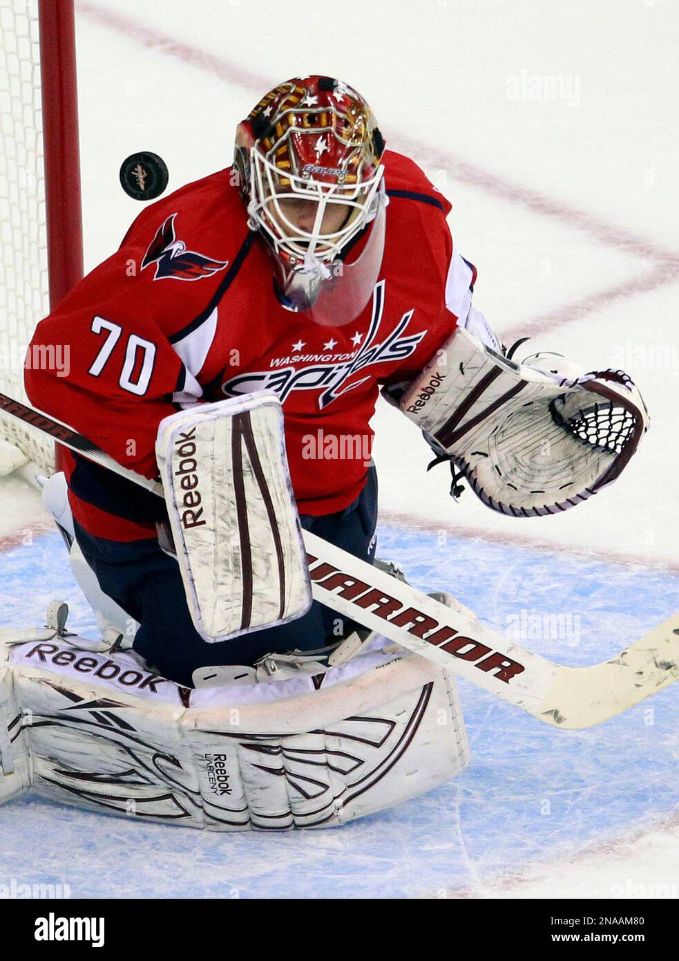 Washington Capitals goalie Braden Holtby watches the puck fly by for a ...