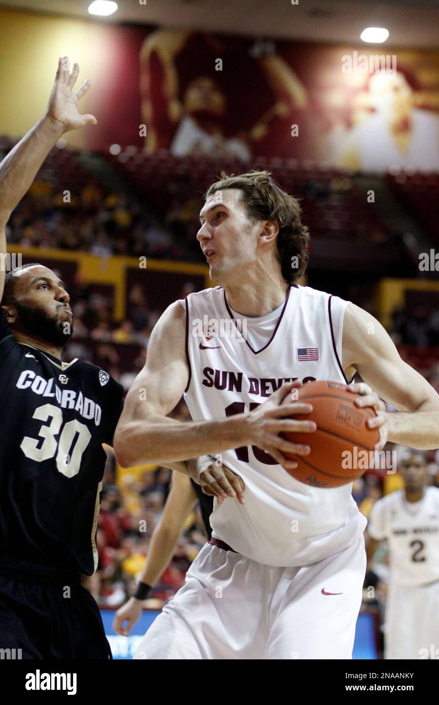 Arizona State's Jordan Bachynski, right, against Colorado's Carlon ...