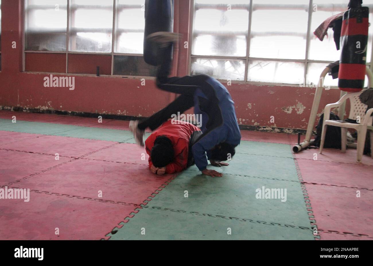 In this Wednesday, Feb. 1, 2012 photo, Afghan boxer women warm them ...