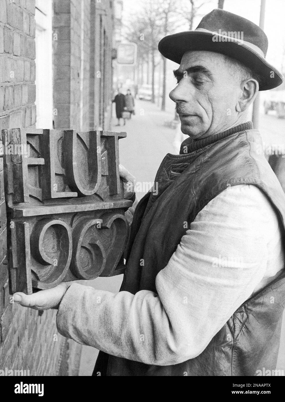 A stonecutter mounts remembrance marks on places in downtown (Harburger ...