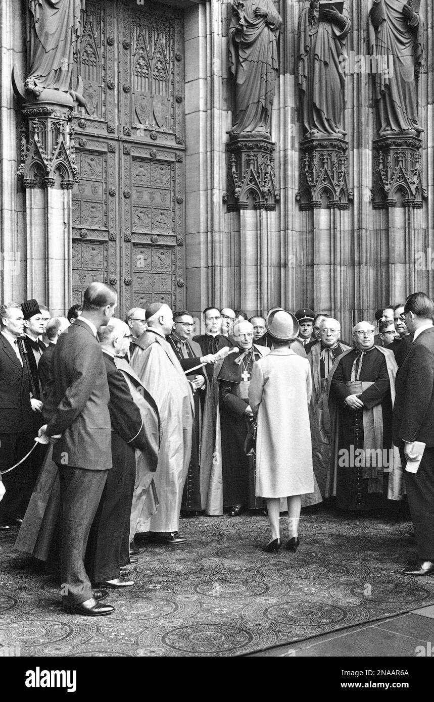 Britain's Queen Elizabeth II is greeted at the door by Cardinal Josef ...