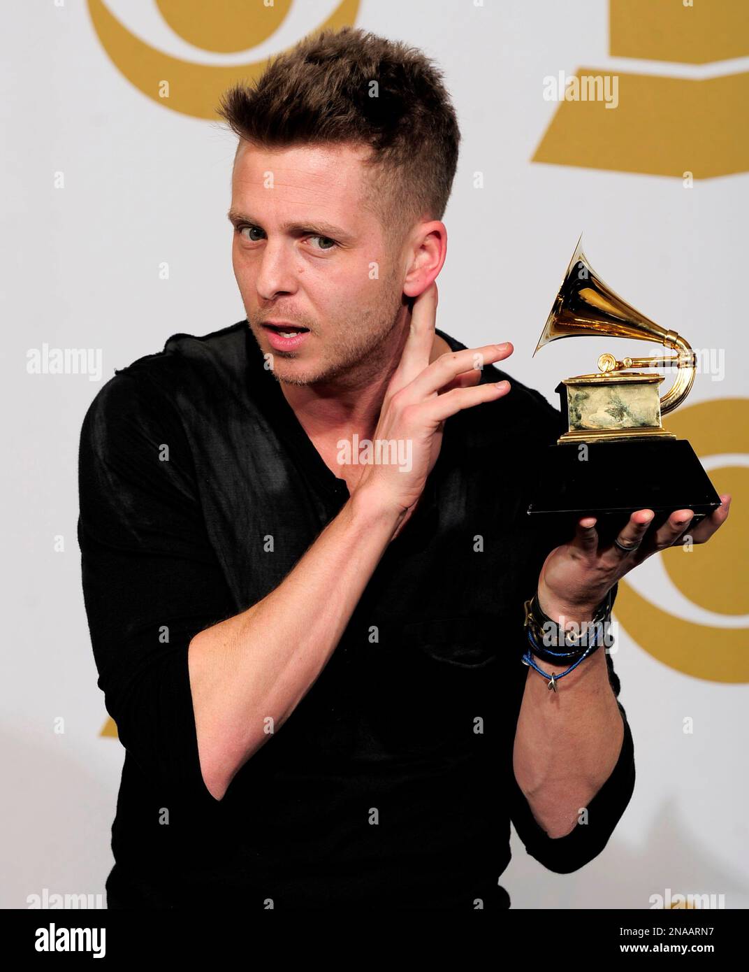 Ryan Tedder poses backstage with the award for album of the year for ...