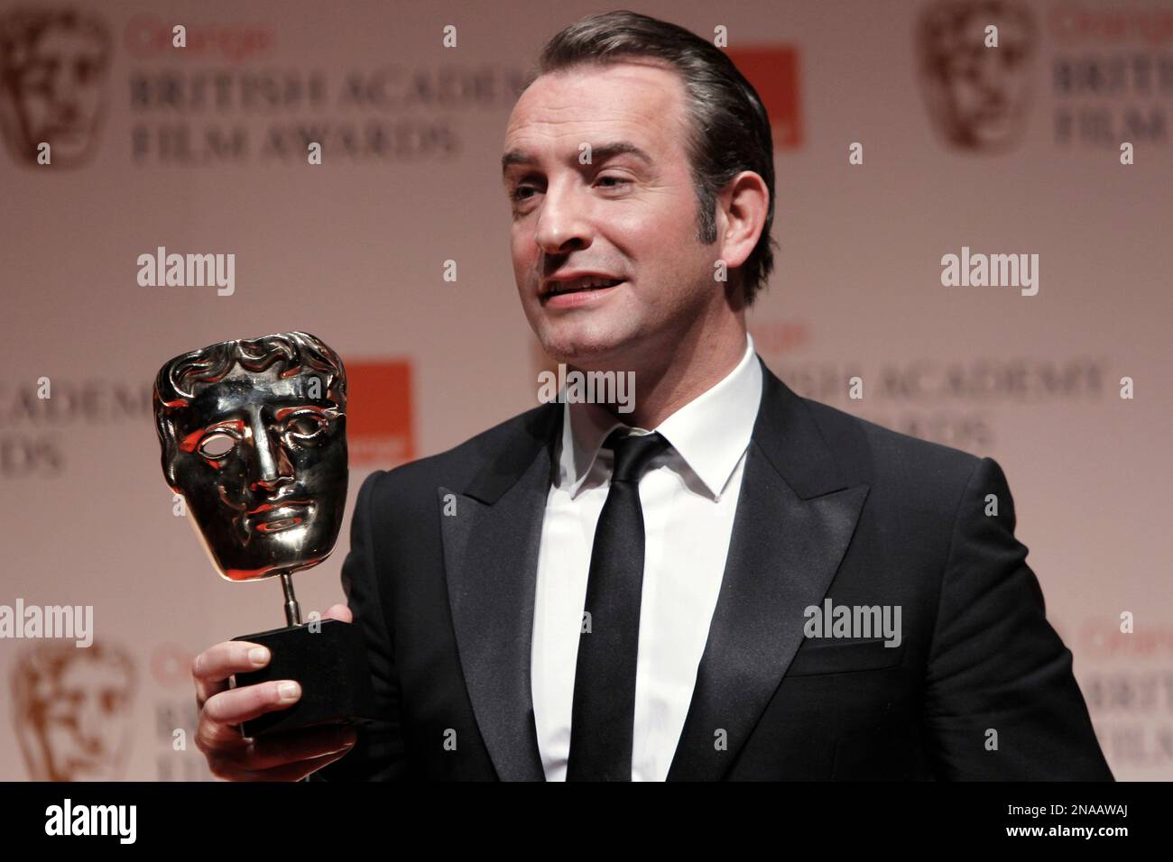 Actor Jean Dujardin with his award for "Best Leading Actor' for the ...