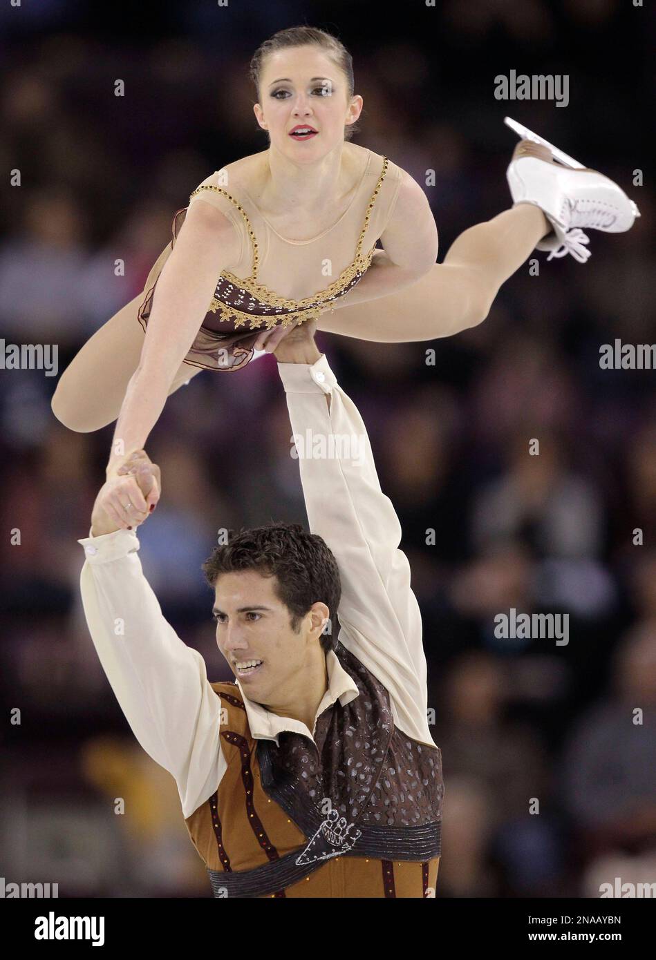 Canada's Paige Lawrence is lifted by Rudi Swiegers as they compete in ...