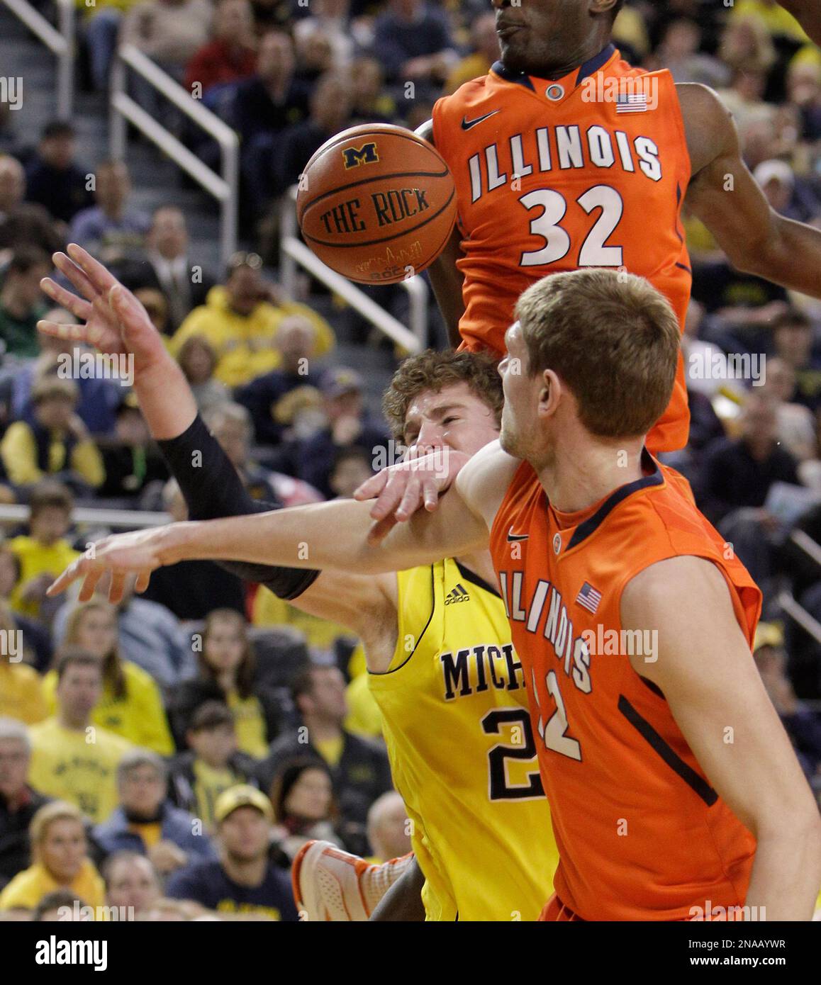 Michigan forward Evan Smotrycz, left, if fouled by Illinois forward ...