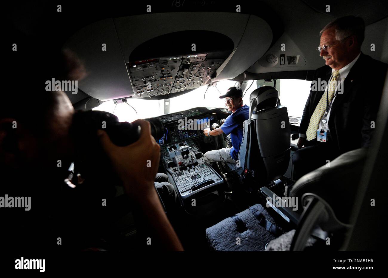 Guests sit in pilot's seats in the cockpit while Boeing's Chief Test ...