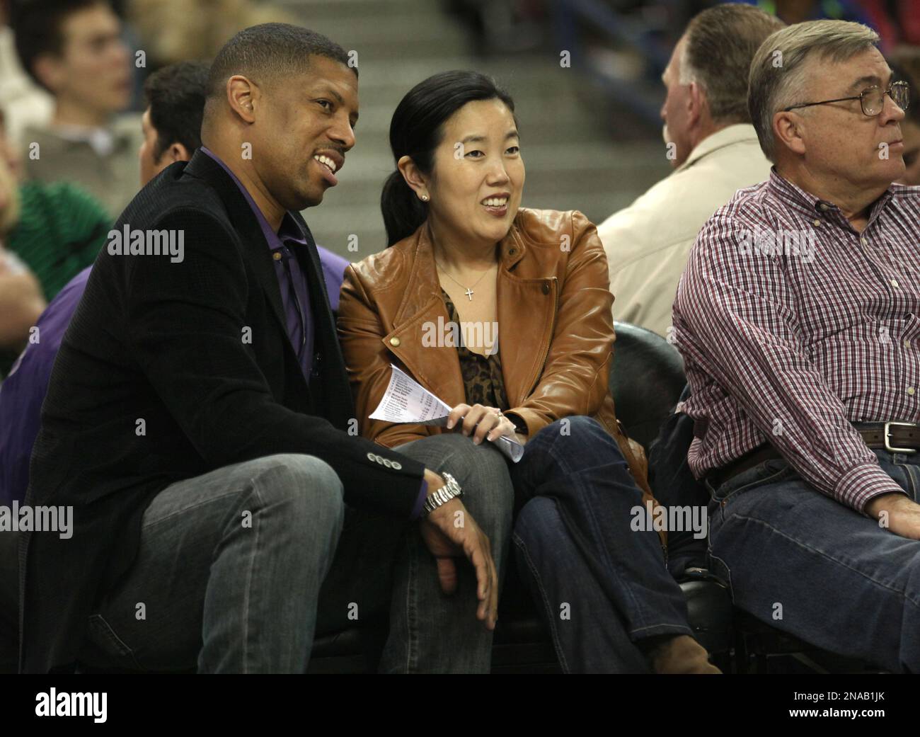 Sacramento Mayor Kevin Johnson, left, watches an NBA basketball game ...
