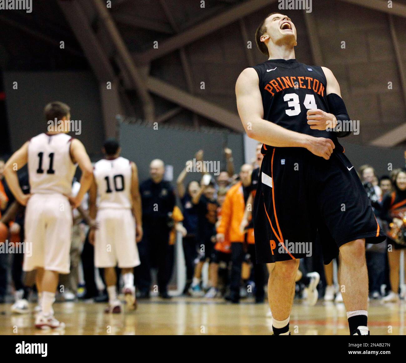 Princeton's Ian Hummer (34) celebrates at the end of the second half of ...