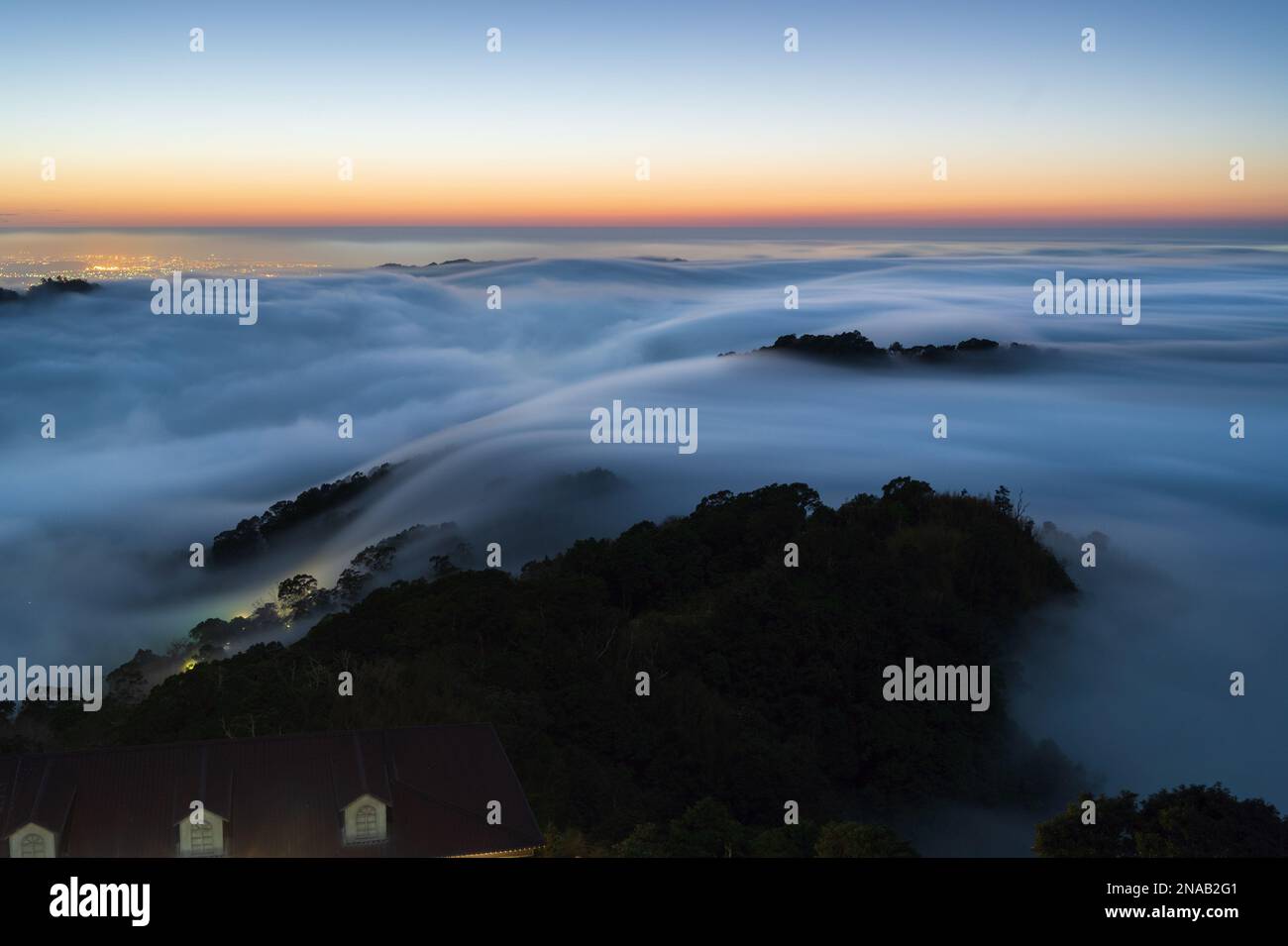 Layers of surging clouds are very spectacular. Sunset behind the ...