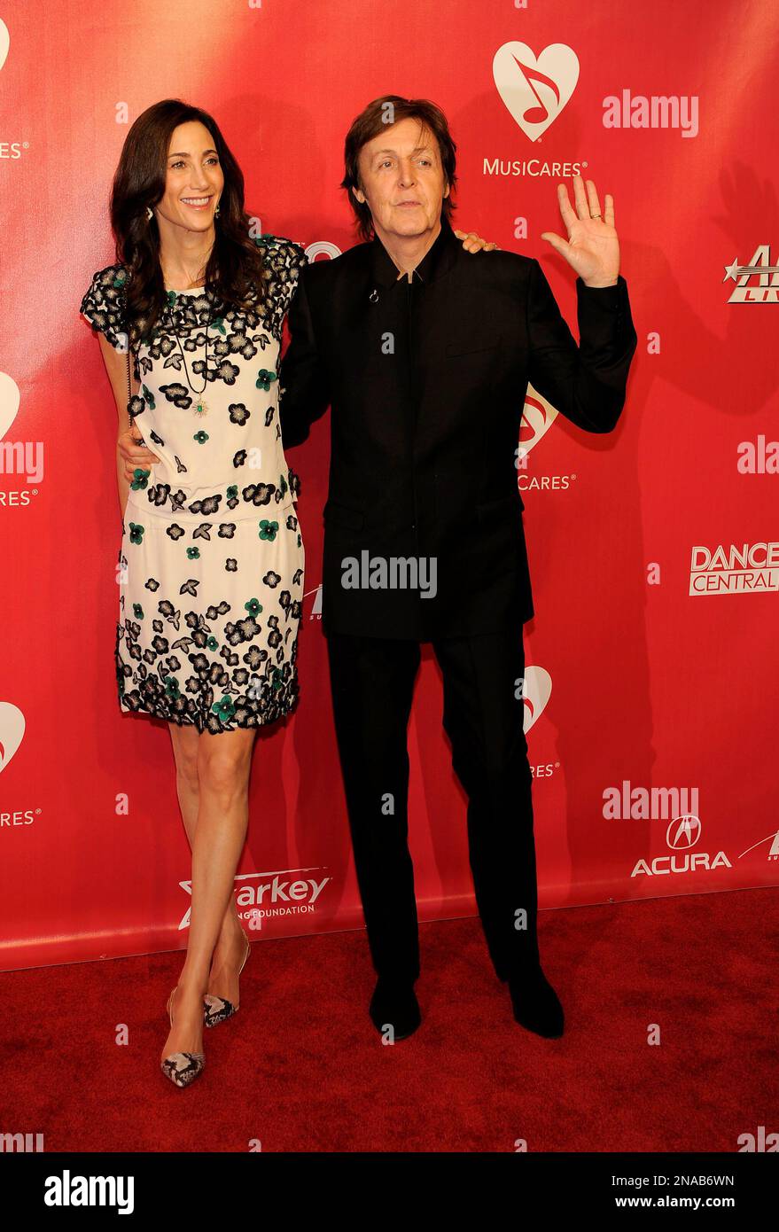 Paul McCartney, right, and Nancy Shevell arrive at the MusiCares Person ...