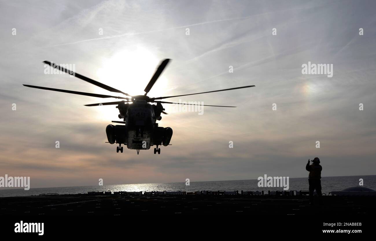 A MH53 Sea Stallion lands aboard the Amphibious Assault Ship USS Wasp in support of Operation ...