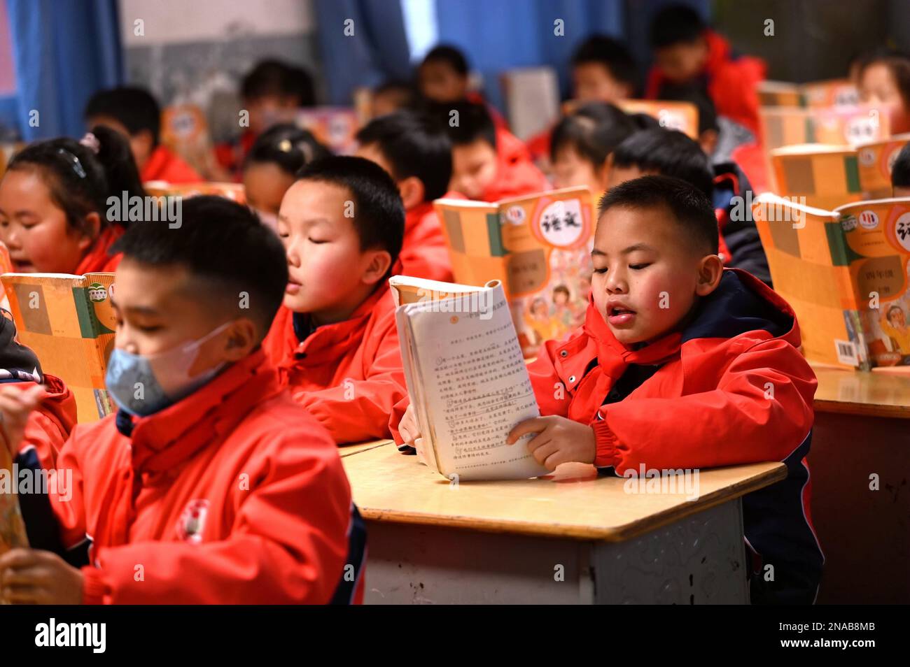 QIANDONGNAN, CHINA - FEBRUARY 13, 2023 - Primary school students are ...