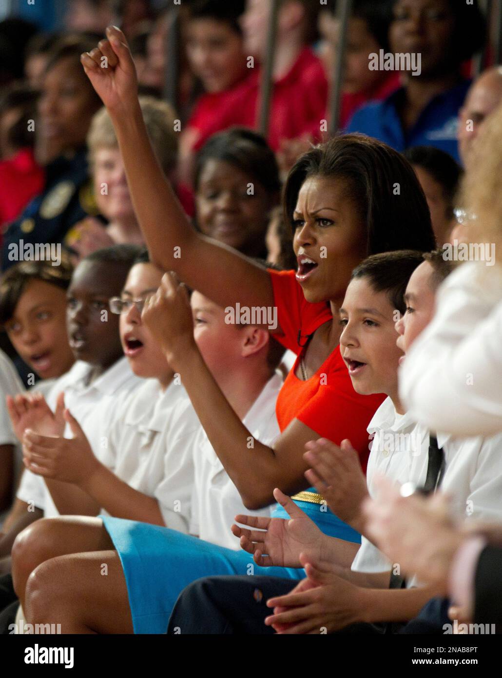 First lady Michelle Obama cheers with students from Nancy Moseley ...