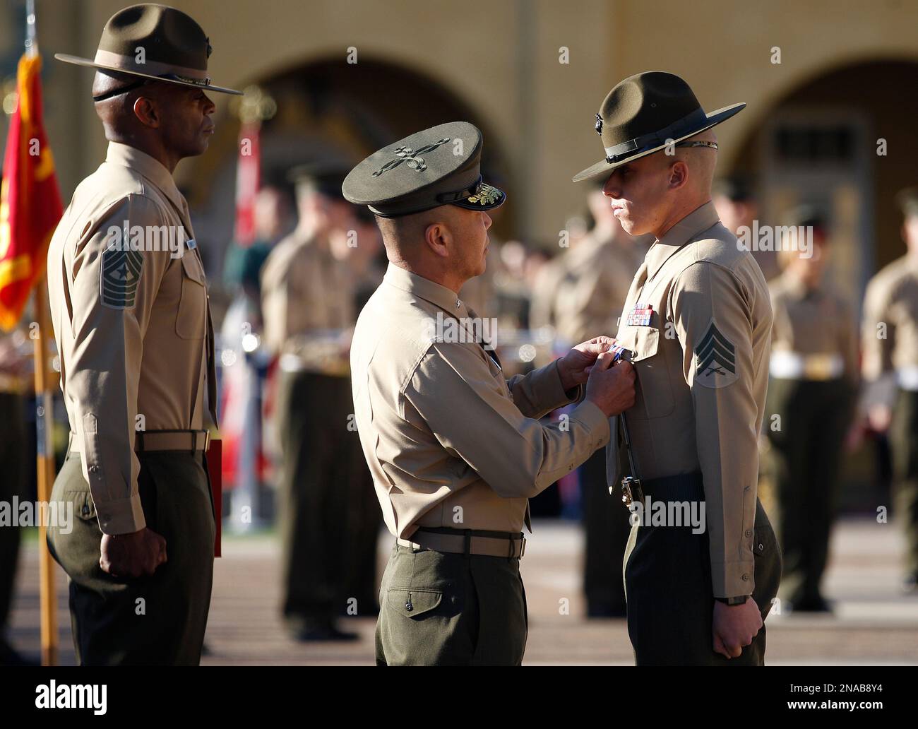 United States Marine Sgt. Philip A. McCulloch Jr., right, receives the ...