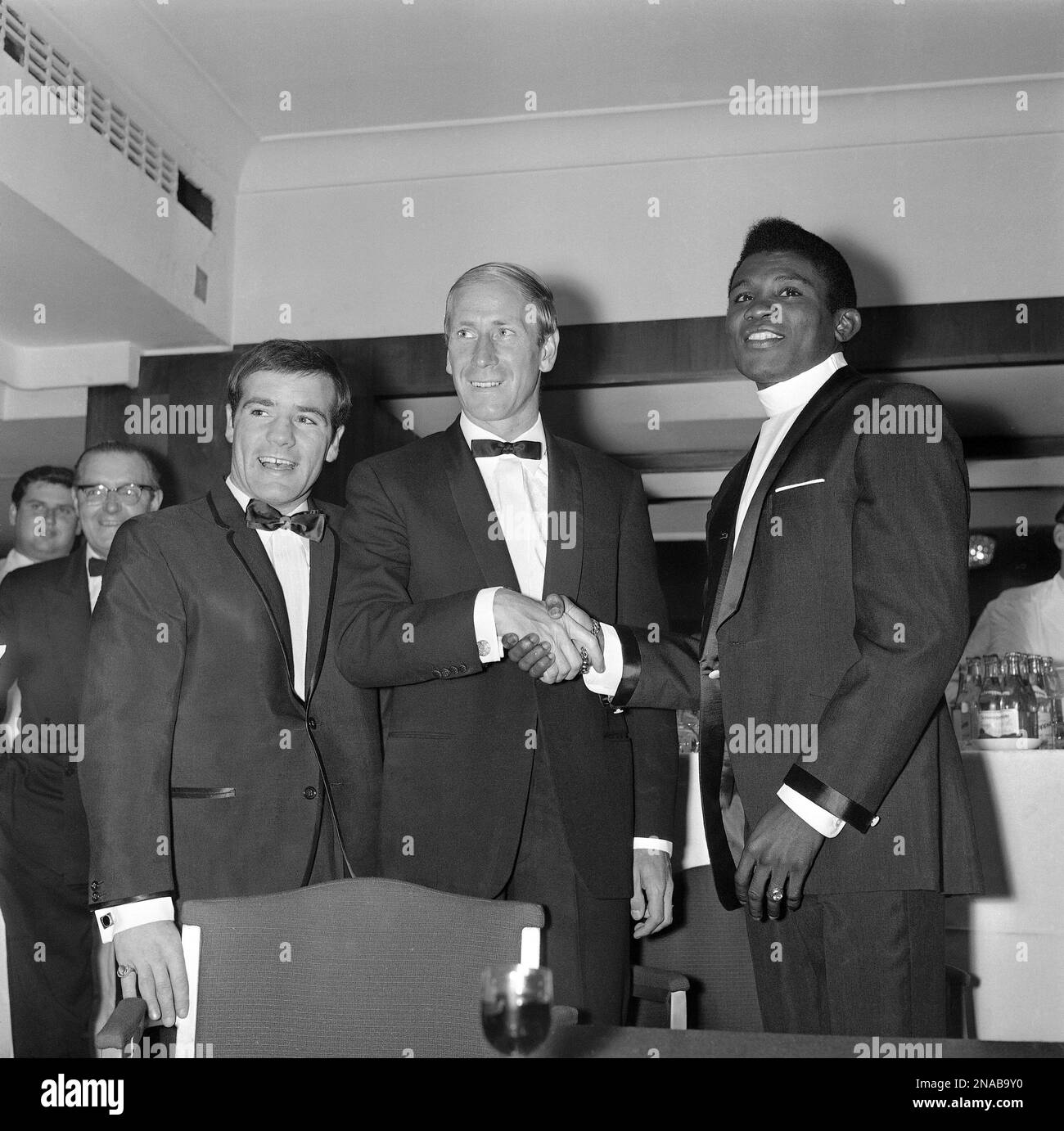 Spanish boxer Jose Legra, right, shakes hands with England footballer ...
