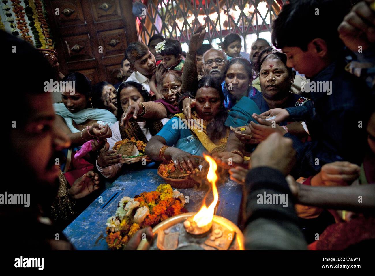 Tamil Hindu worshippers crowd as part of a blessing ritual for the ...