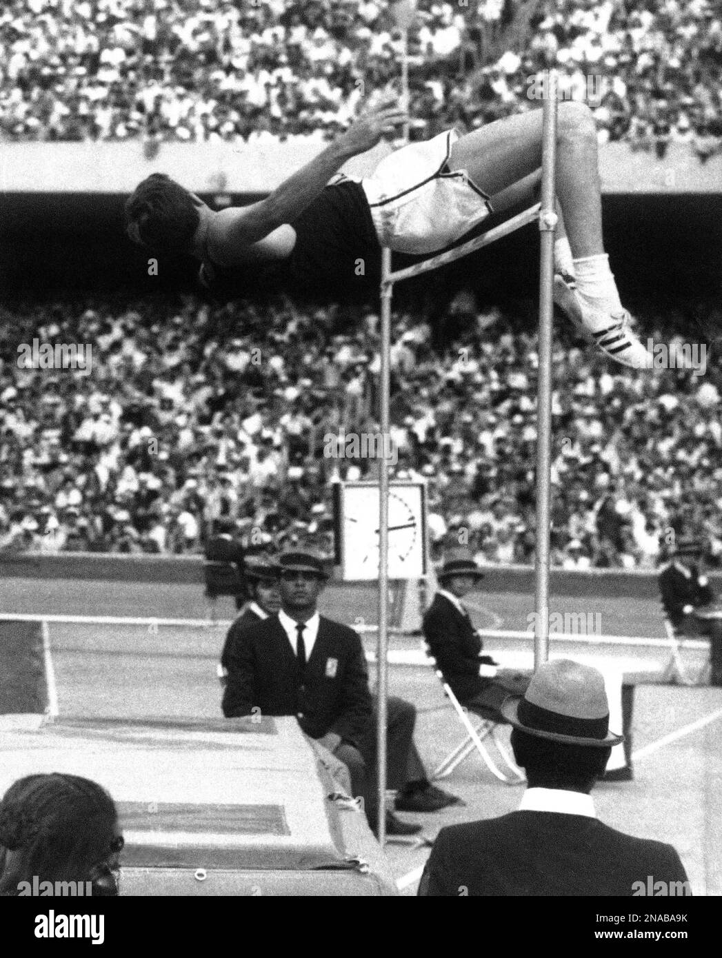 American athlete Dick Fosbury, shows the style he used to win the gold ...