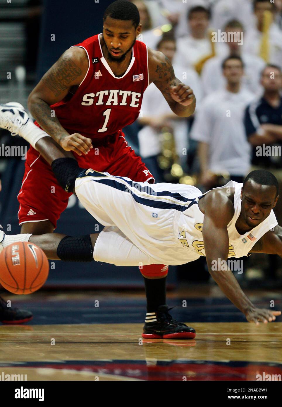 Georgia Tech guard Mfon Udofia (0) loses the ball as North Carolina ...