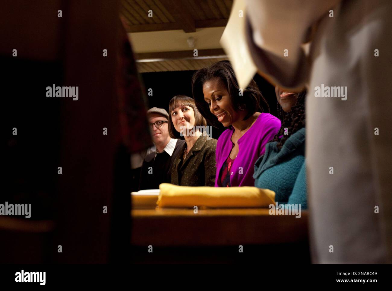 First lady Michelle Obama looks to her menu as she participates in a ...