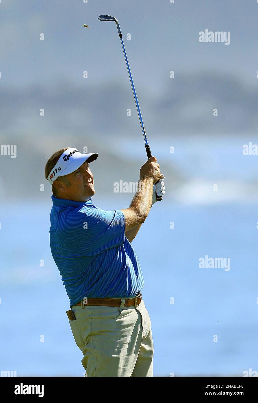 Ken Duke hits from the 18th fairway at Pebble Beach Golf Links during ...