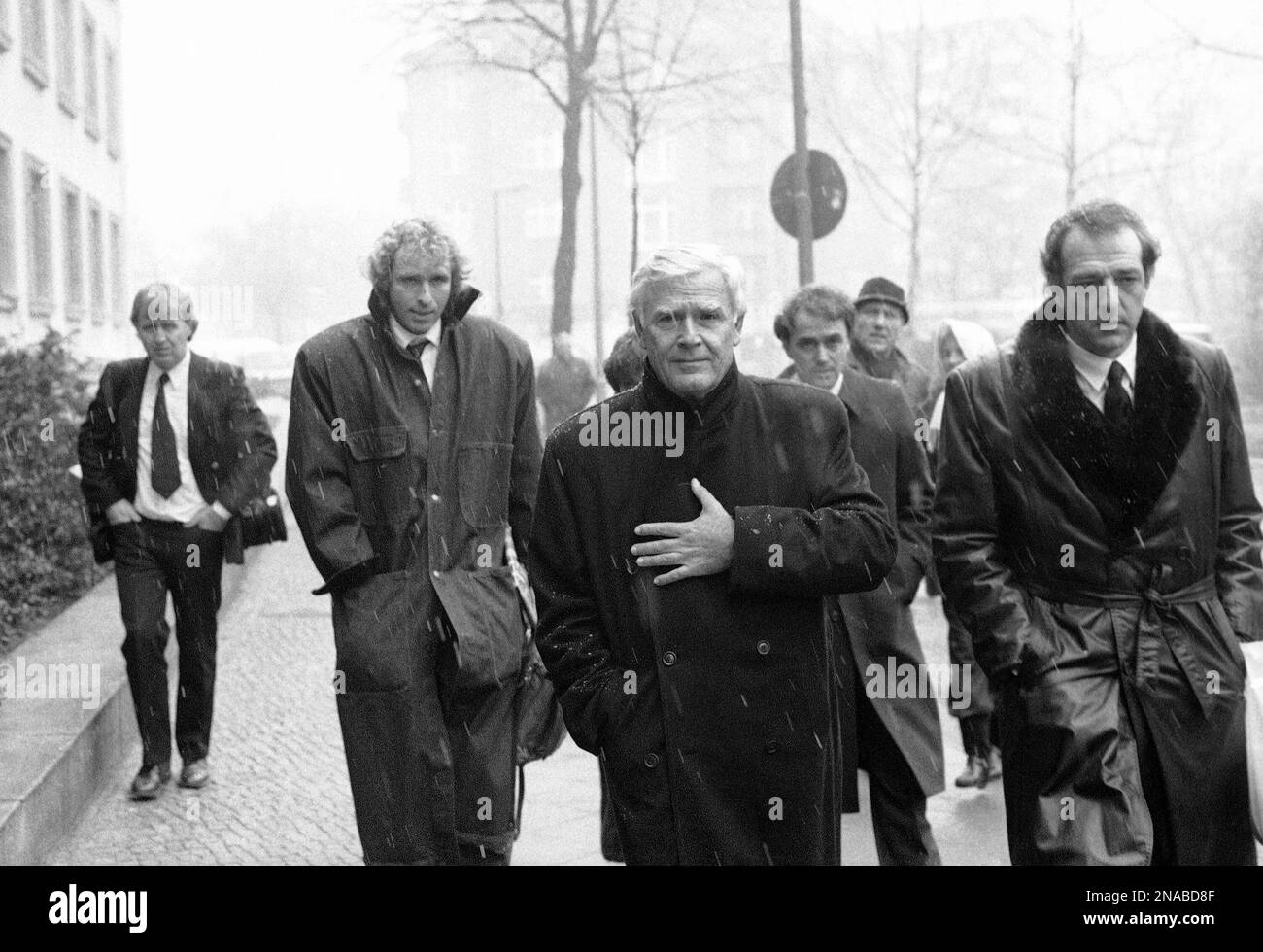 Walking through the rain to the funeral service of German TV host and ...