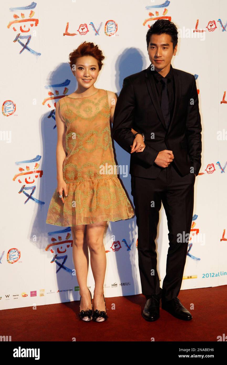 Taiwanese actress Amber Guo Cai-jie and Taiwanese actor Mark Chao pose as they arrive at the ...