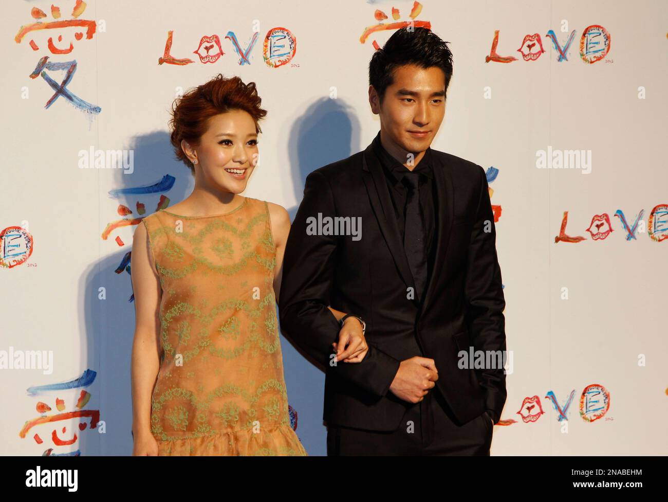 Taiwanese actress Amber Guo Cai-jie and Taiwanese actor Mark Chao pose as they arrive at the ...