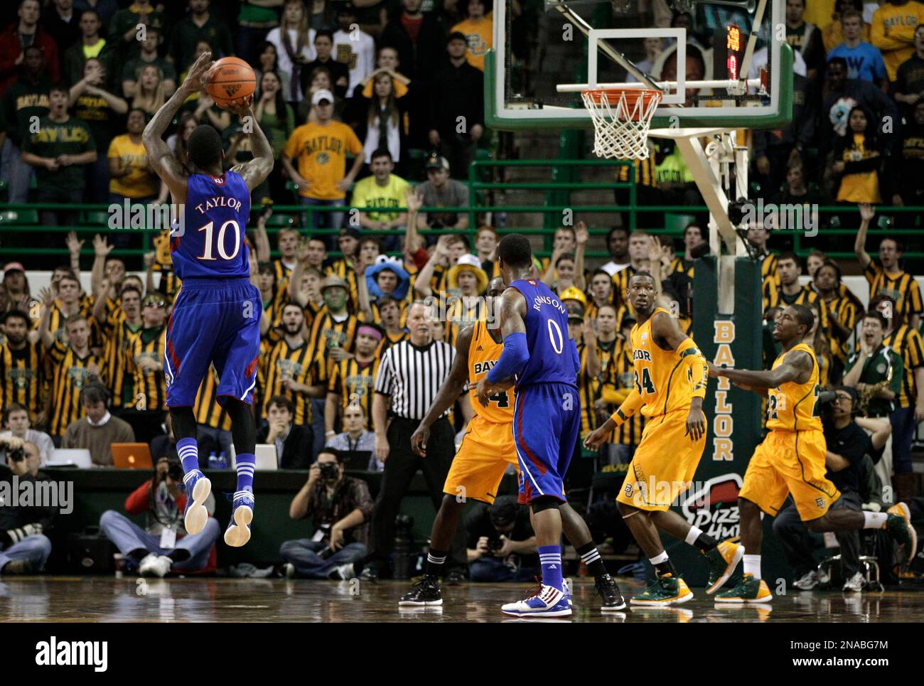 Kansas guard Tyshawn Taylor (10) shoots and makes a 3-point-basket ...