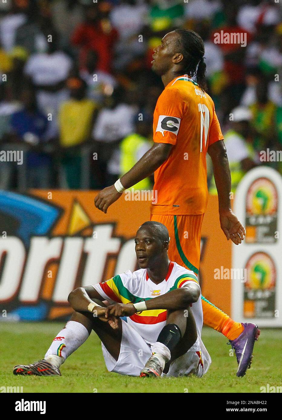 Ivory Coast captain Didier Drogba, top, walks after their victory as ...
