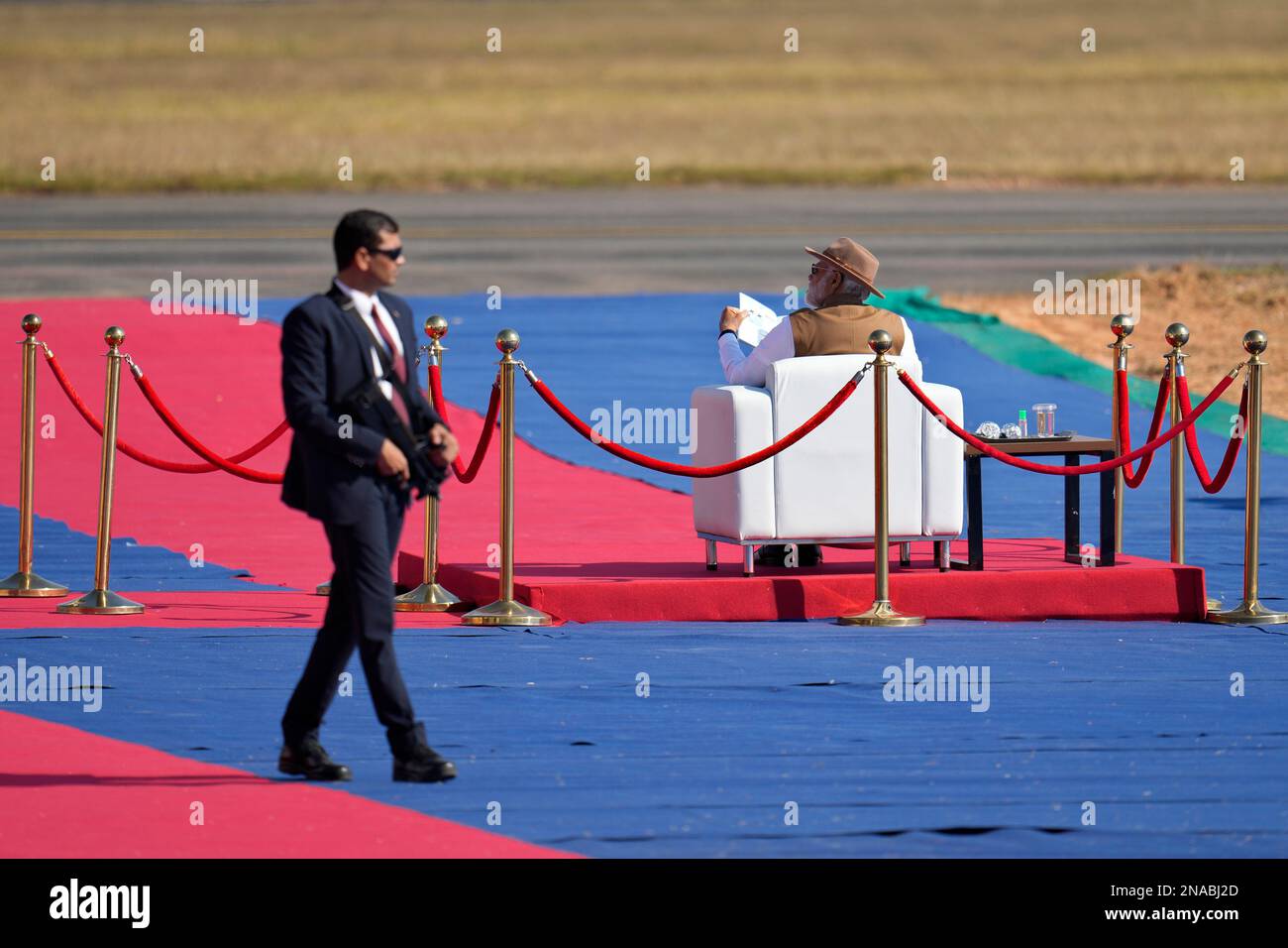 A security-man guards as Indian Prime Minister Narendra Modi watches ...