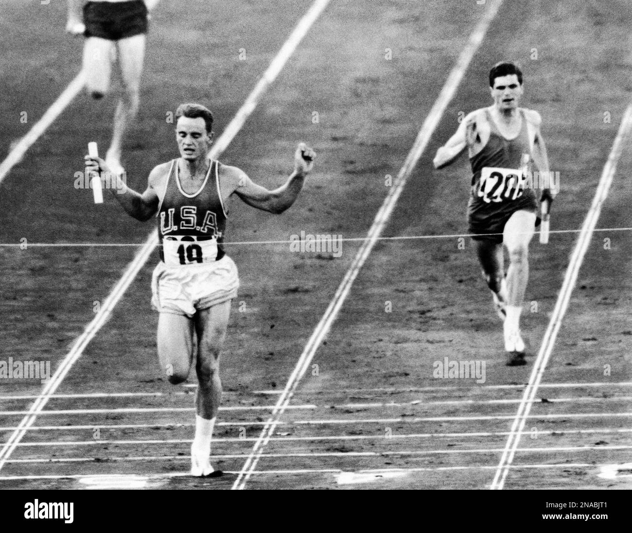 Dave Sime, left of USA, finishes first in heat 4 of the Summer Olympic ...